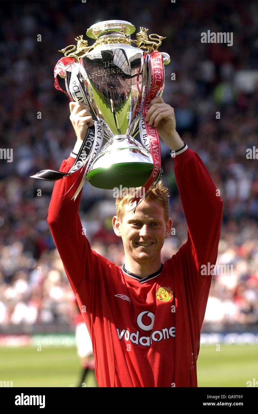 Manchester United reserve team captain Michael Stewart holds aloft the ...