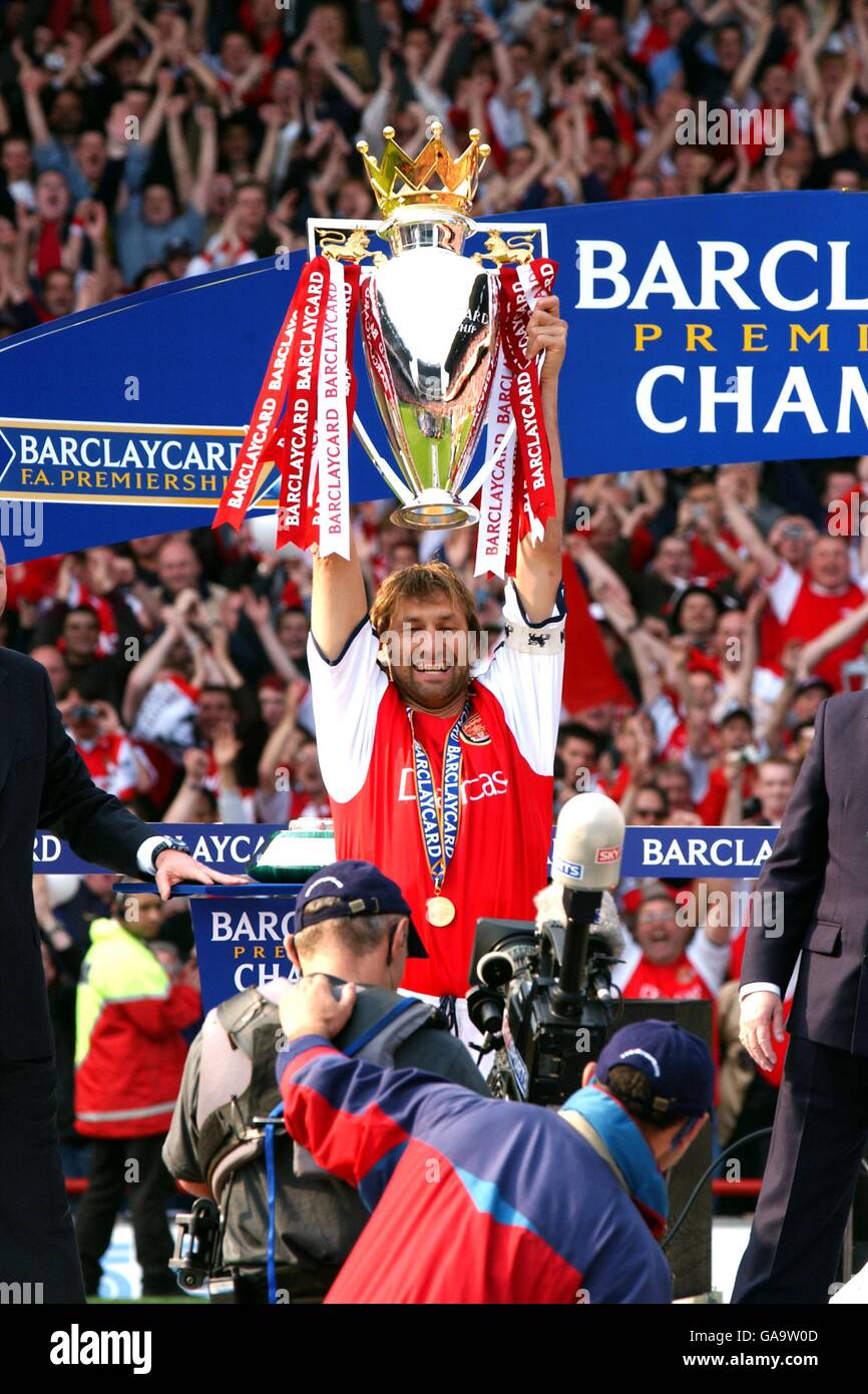 Arsenal's Tony Adams holds aloft the FA Barclaycard Premiership trophy ...