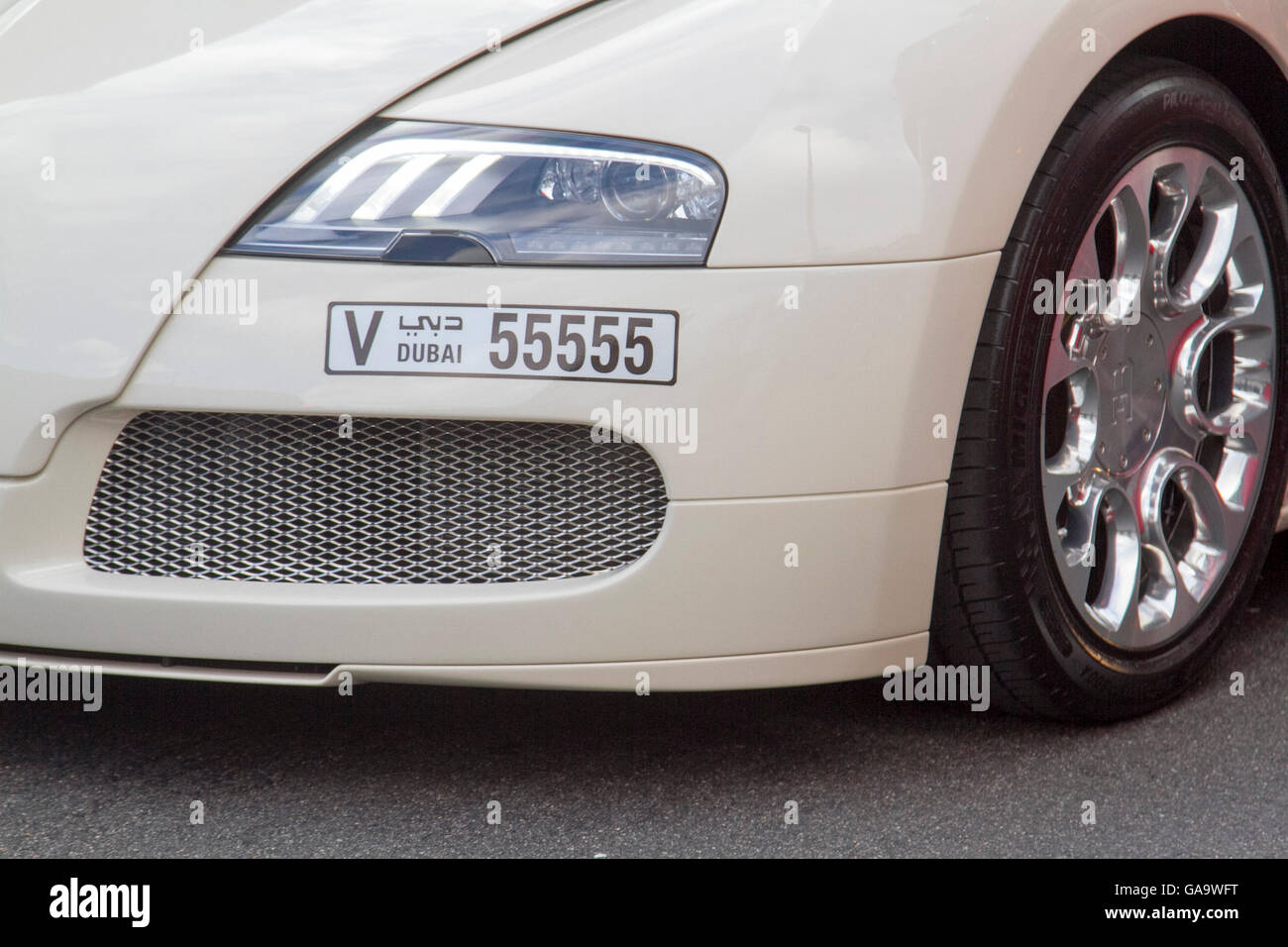 London,UK. 3rd August 2016. A beige Bugatti sports car with Dubai ...