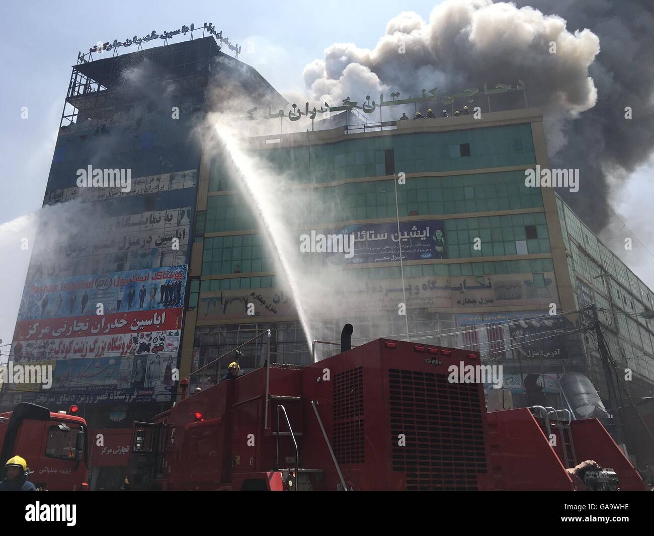 Kabul, Afghanistan. 4th August, 2016.Firefighters try to extinguish the ...
