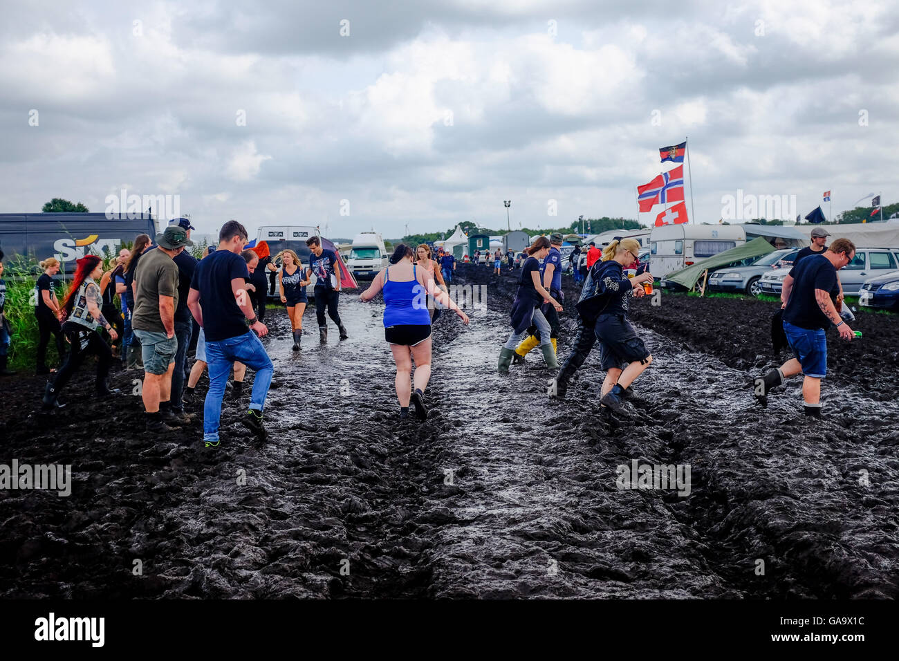 Wacken, Germany. 4th Aug, 2016. Metal fans walking through the mud on ...