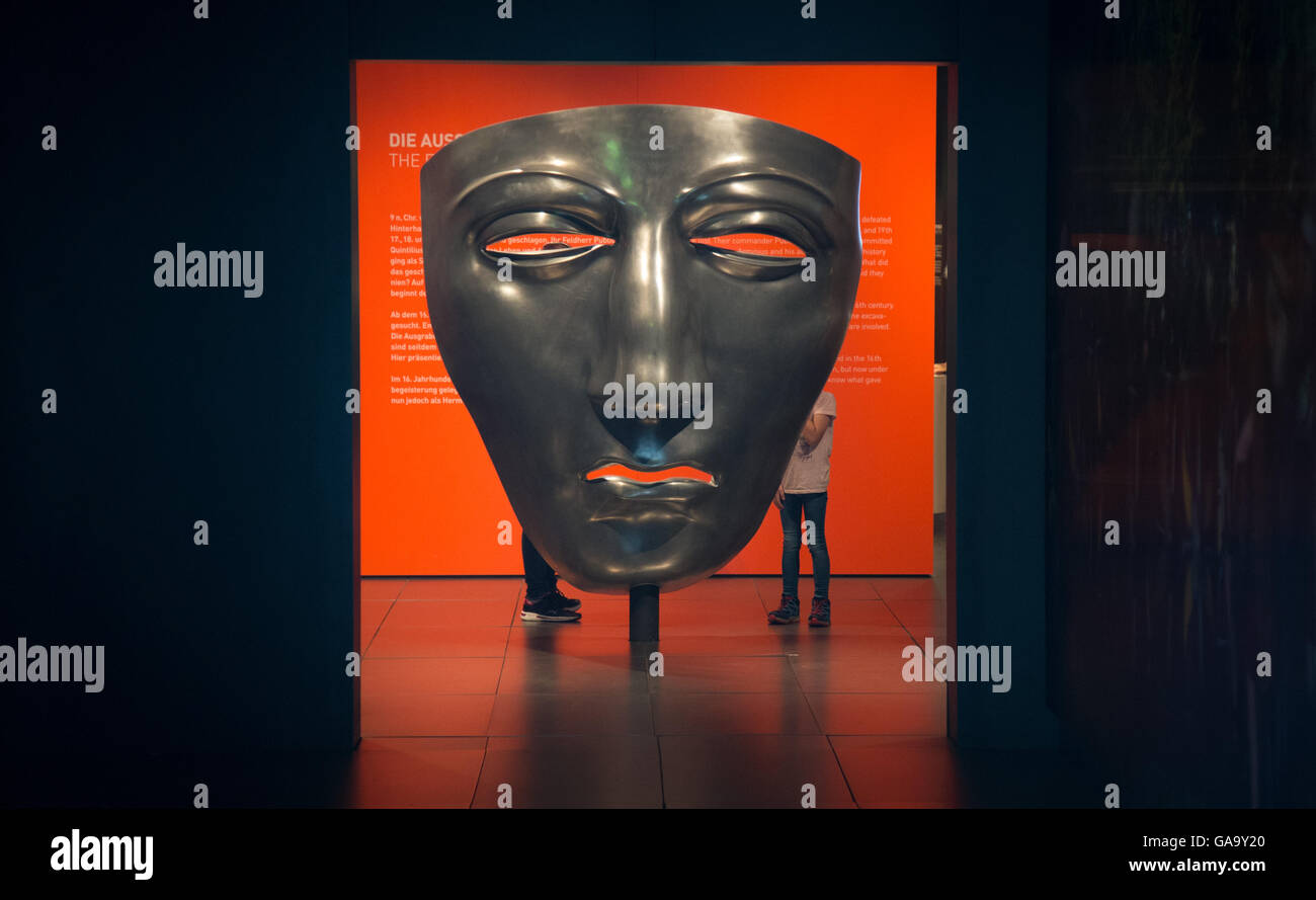 Bramsche-Kalkriese, Germany. 30th June, 2016. Visitors behind an ...