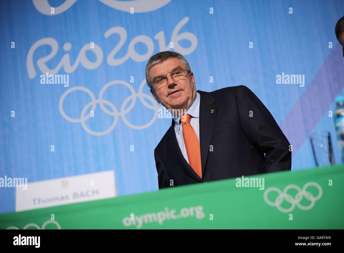 IOC President Thomas Bach of Germany arrives for a press conference in the Main Press Center ...