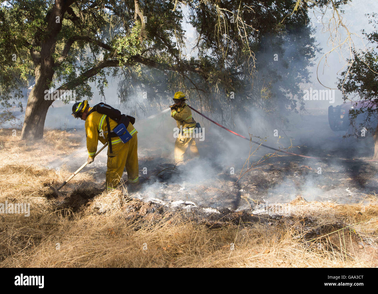 Modesto, CA, USA. 3rd Aug, 2016. Firefighters create a fire break along ...