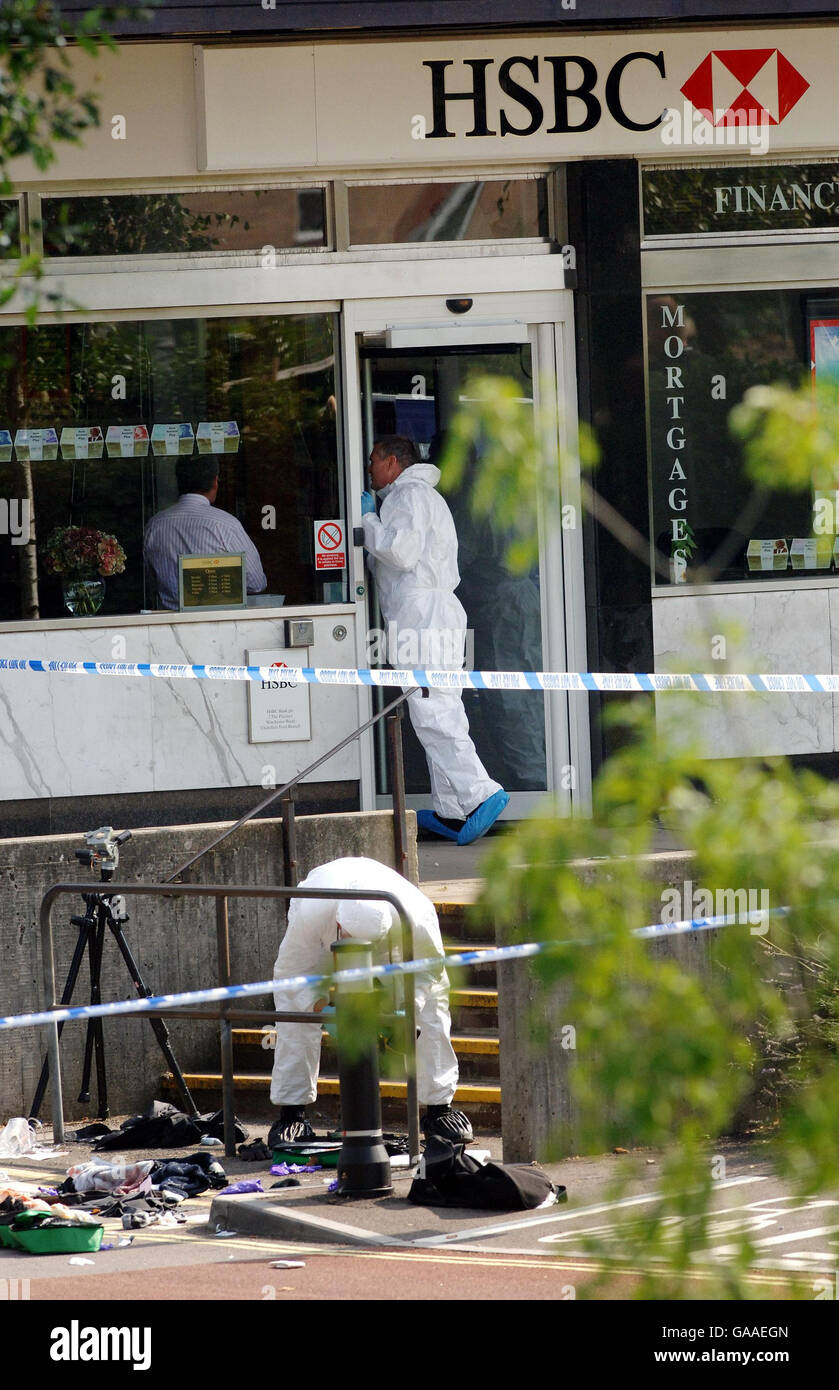 Police at the scene where two robbers were shot dead at an HSBC bank at ...