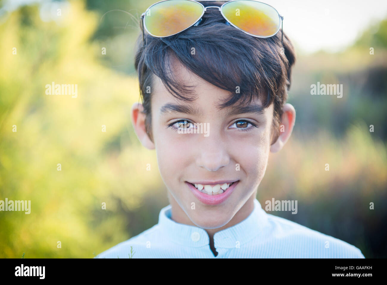 Portrait of a cute boy on the background of nature Stock Photo - Alamy