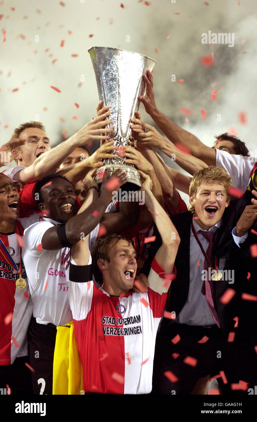 Feyenoord's captain Paul Bosvelt lifts the UEFA cup trophy after ...