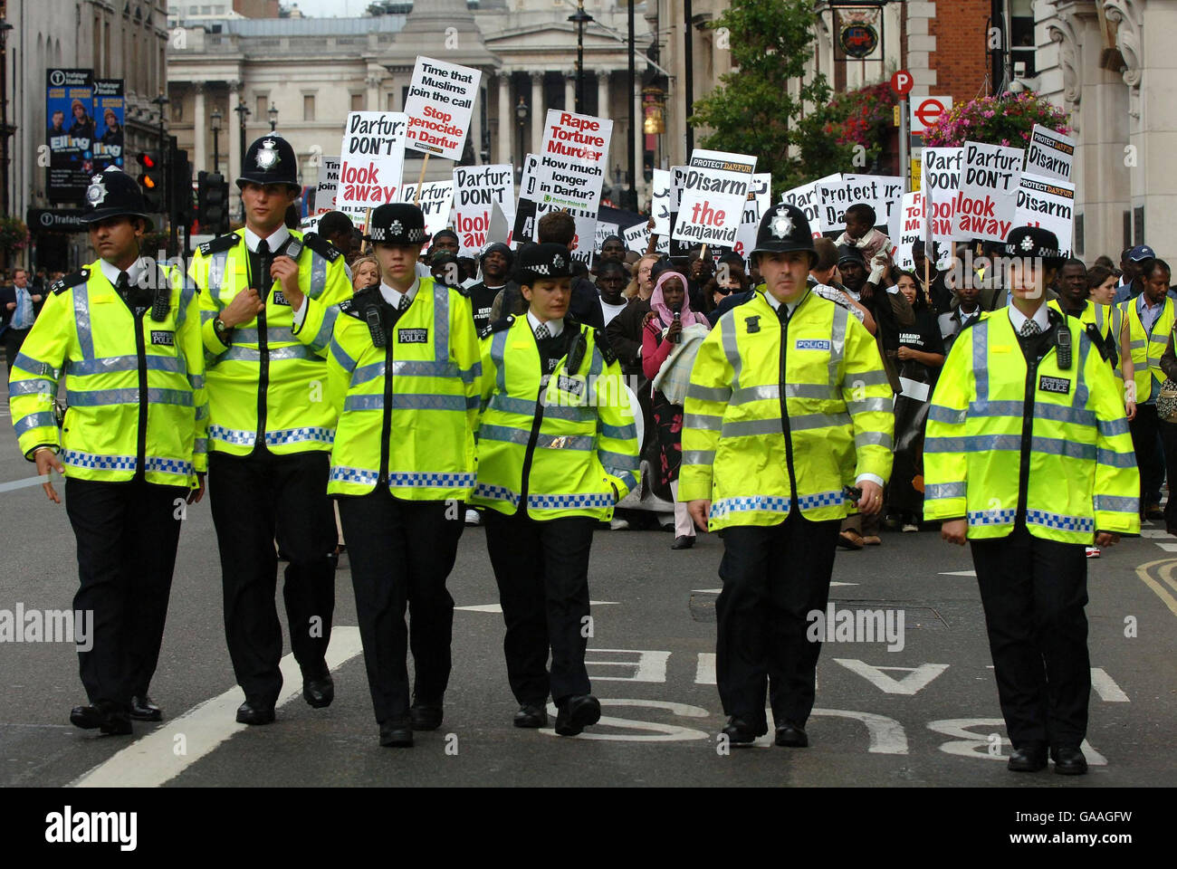 Police lead a march along Whitehall to Downing Street, London, as ...
