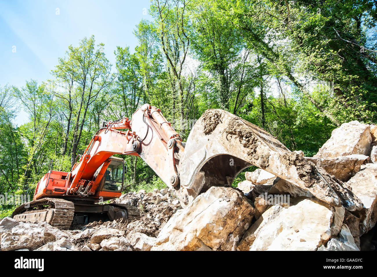 Excavator with big shovel to work with rocks Stock Photo - Alamy