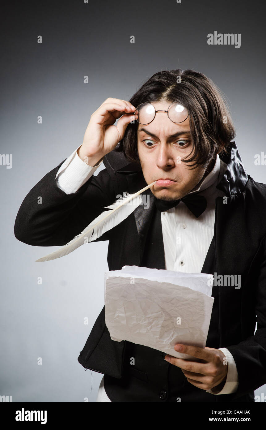 Funny writer with quill in vintage concept Stock Photo - Alamy