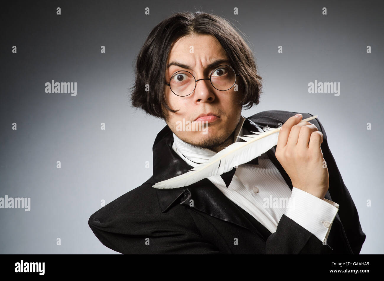Funny writer with quill in vintage concept Stock Photo - Alamy
