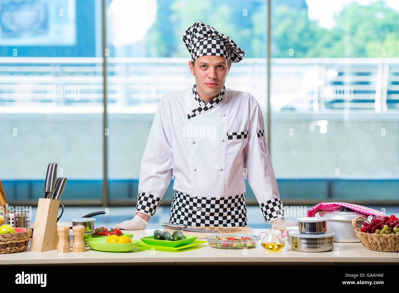 Male cook preparing food in the kitchen Stock Photo - Alamy