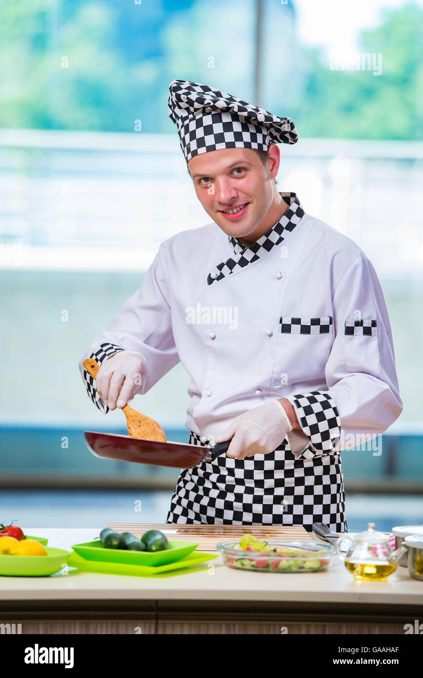 Male cook preparing food in the kitchen Stock Photo - Alamy