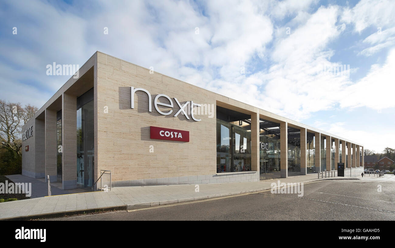 Facade perspective with stone cladding, logo and colonnade. Next - Home ...