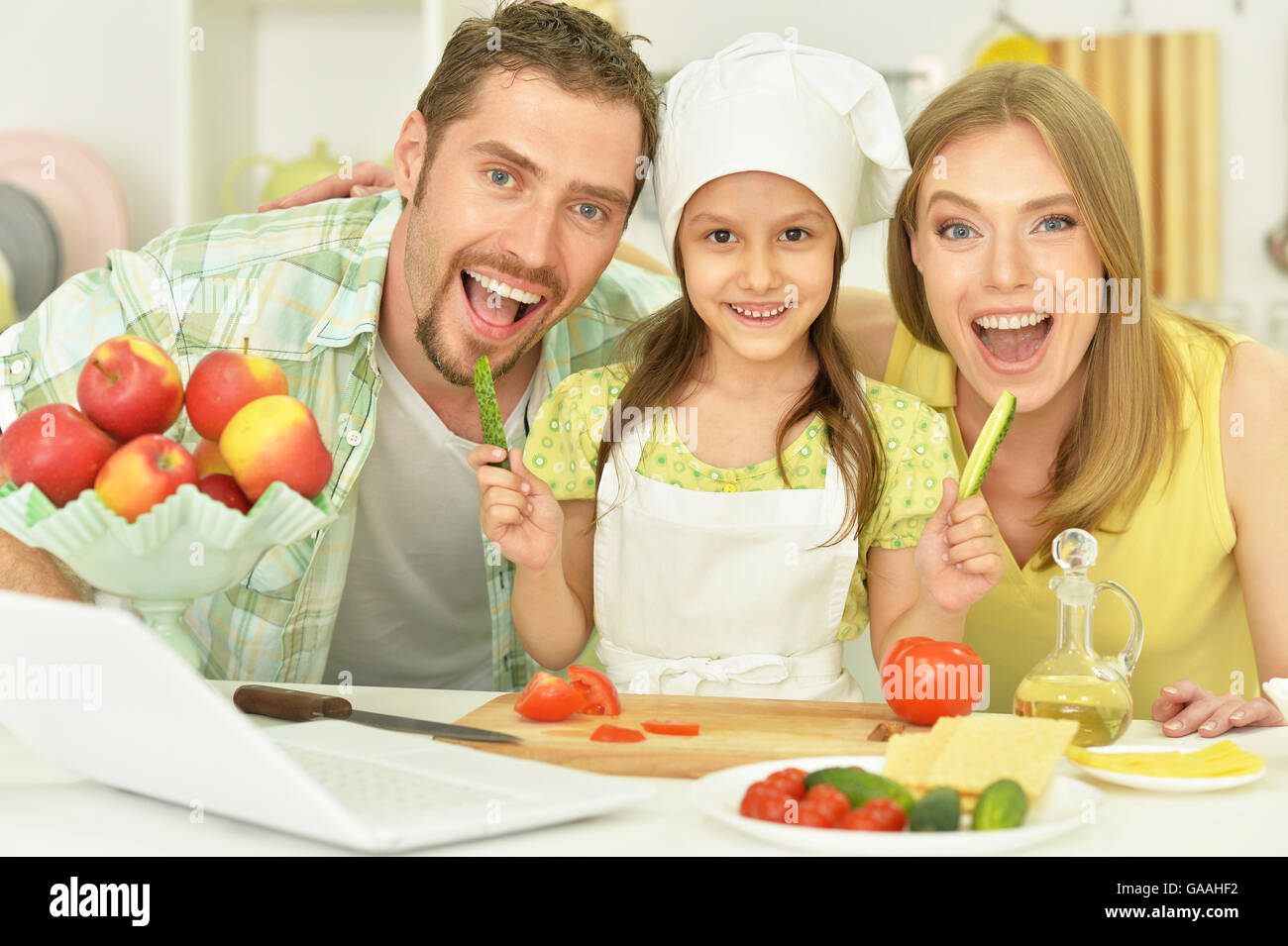happy family cooking in kitchen Stock Photo - Alamy