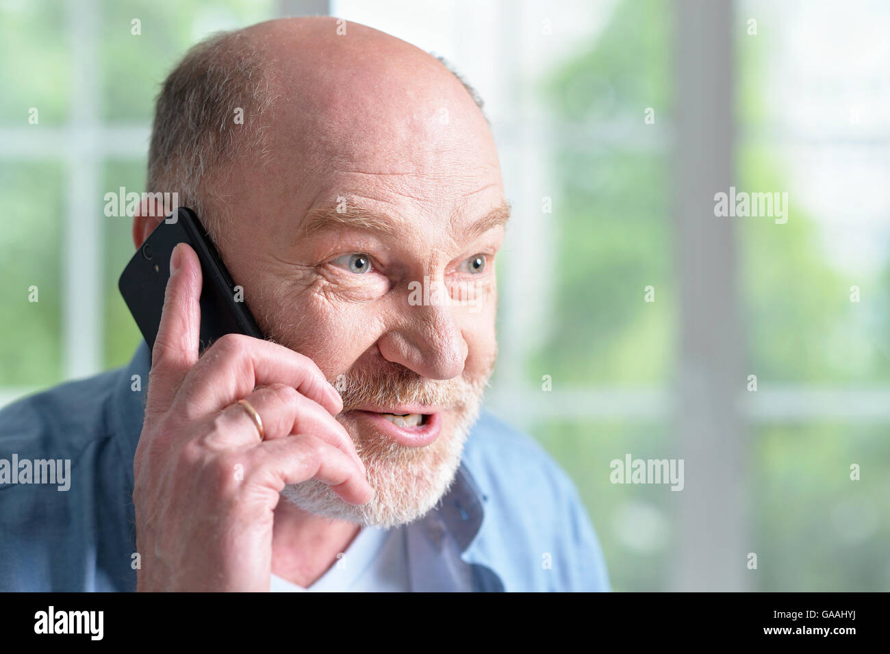 elderly man with phone Stock Photo - Alamy