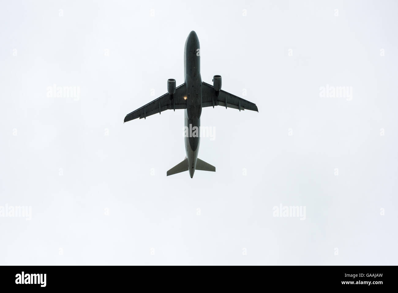 Airplane taking off during rain Stock Photo - Alamy
