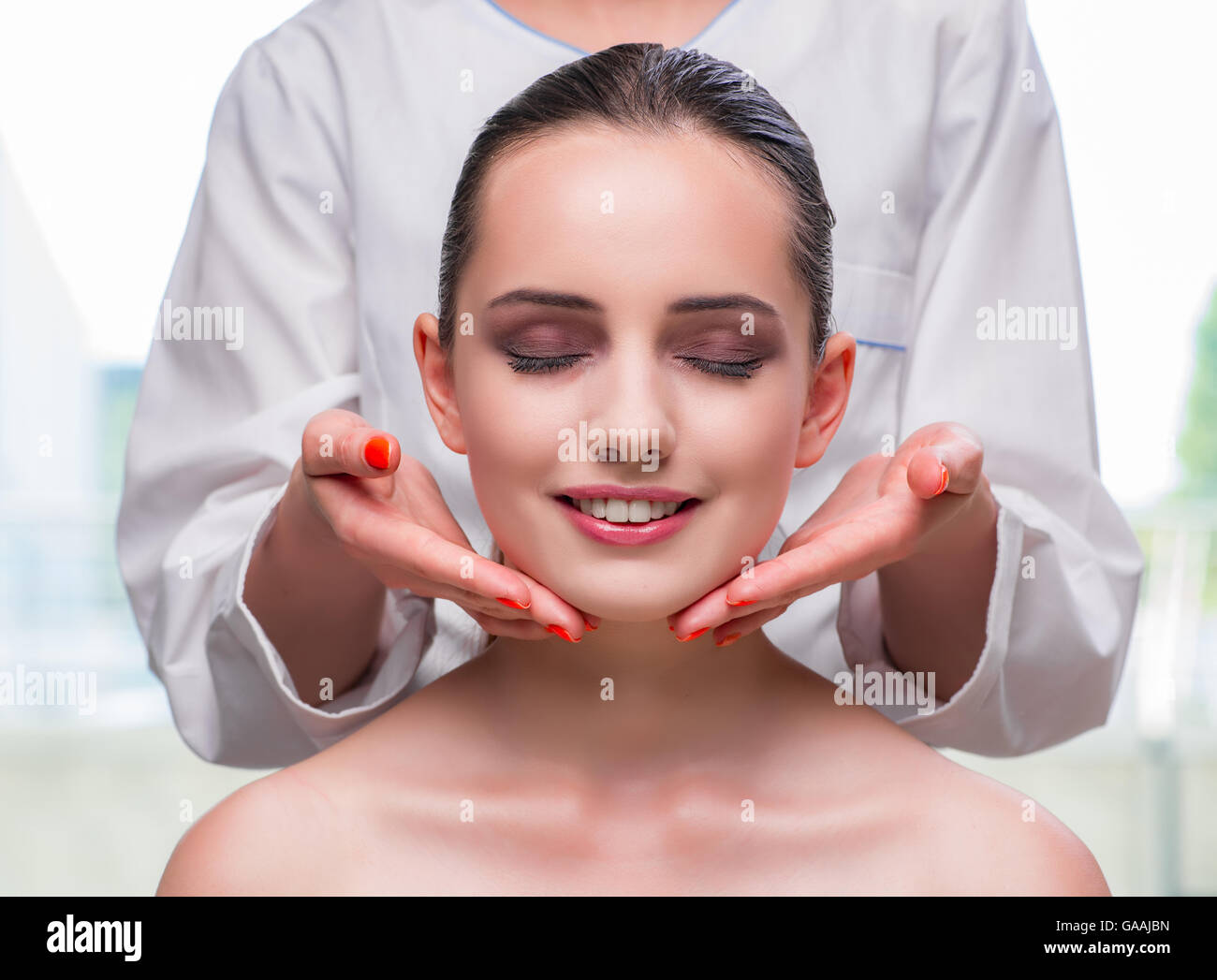 Young woman during face and skin massage session Stock Photo - Alamy