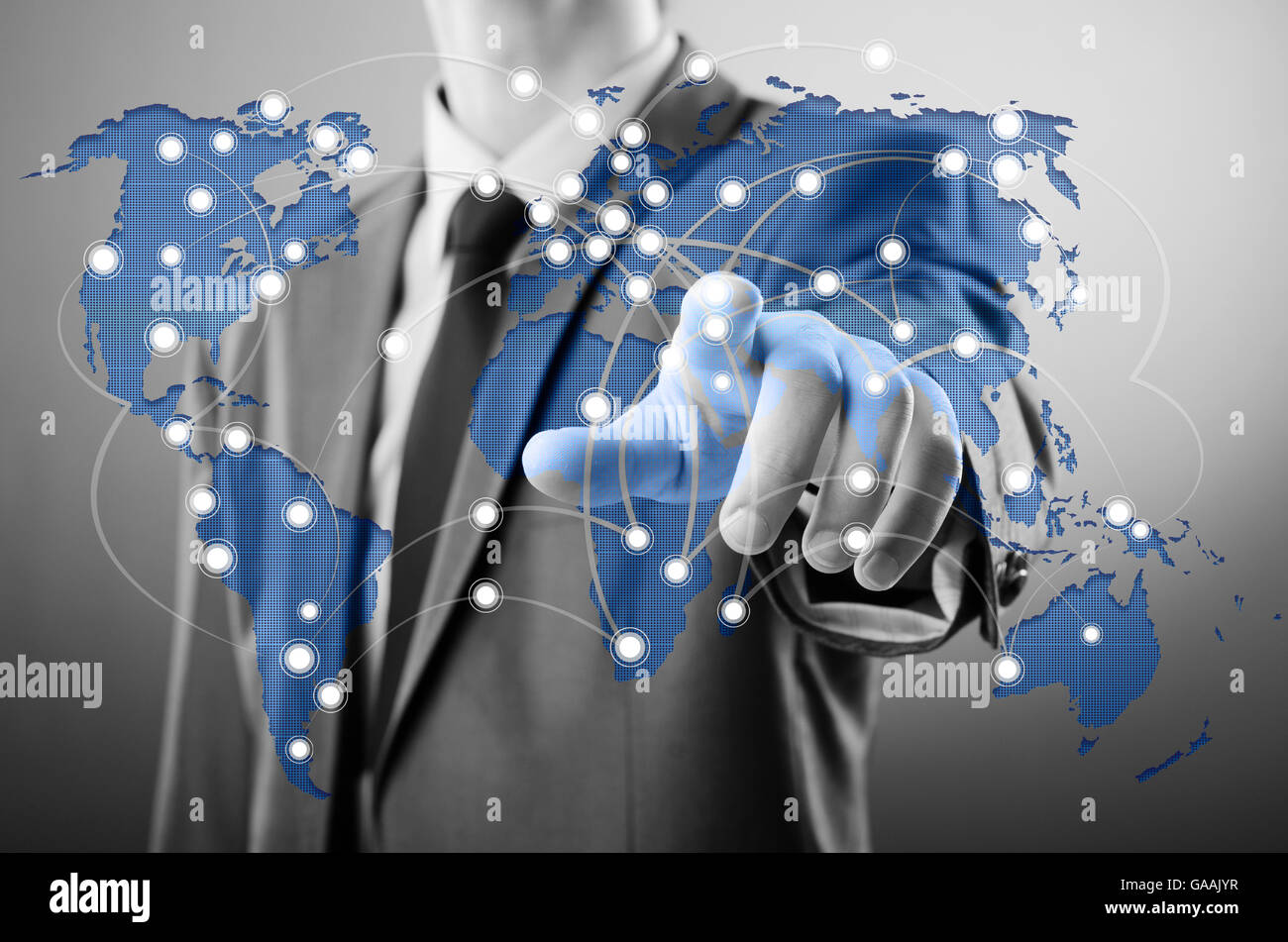 Man pressing dots on world map in global communication concept Stock ...