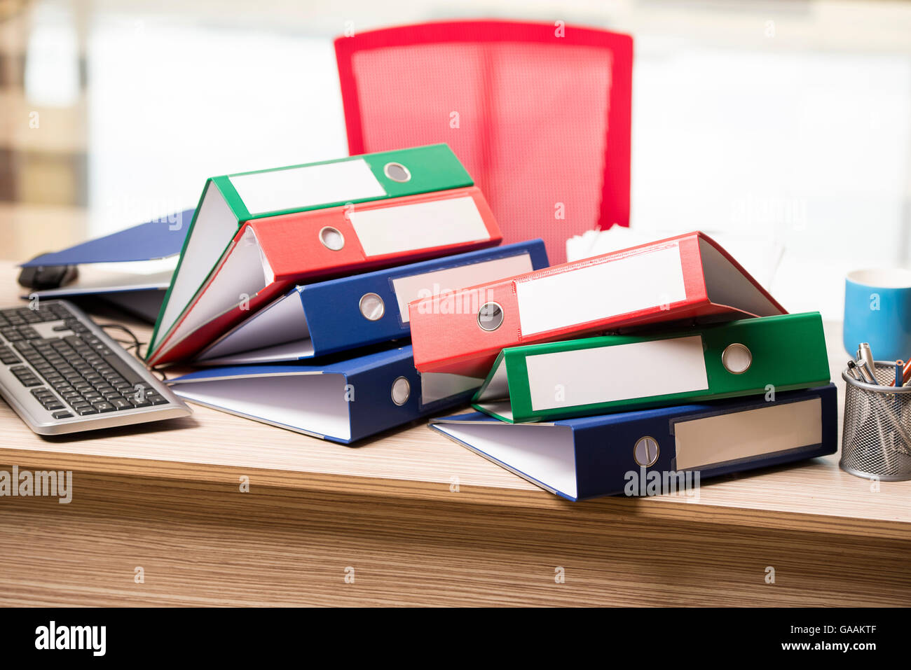 Stacks of office binders on desk Stock Photo - Alamy