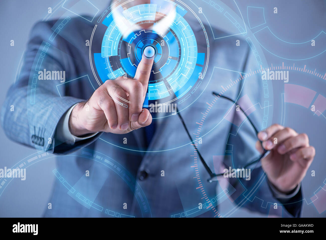 Businessman pressing virtual buttons in futuristic concept Stock Photo ...