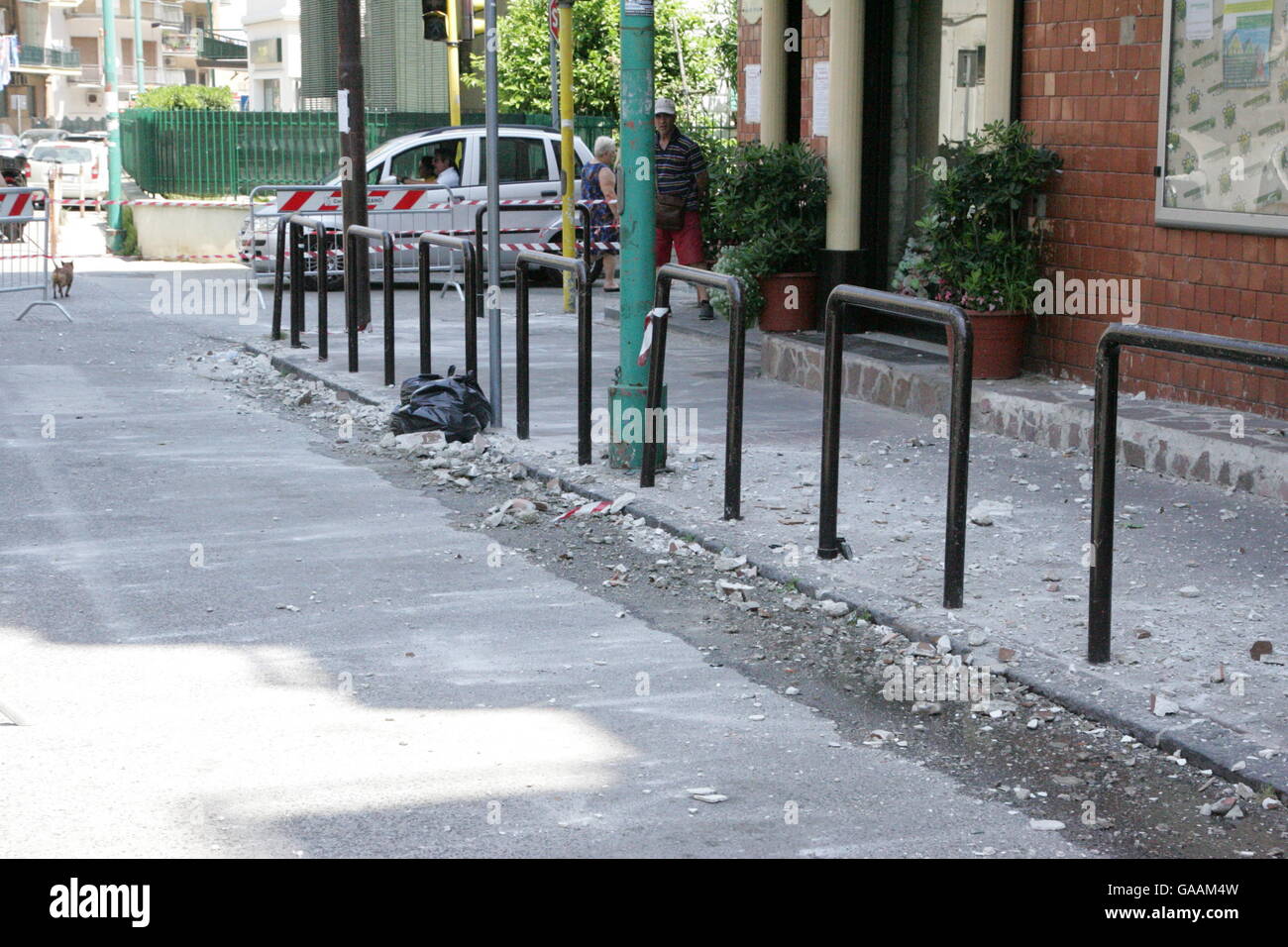 Fallen rubble from a building cornices in Arzano. Falling rubble from a ...