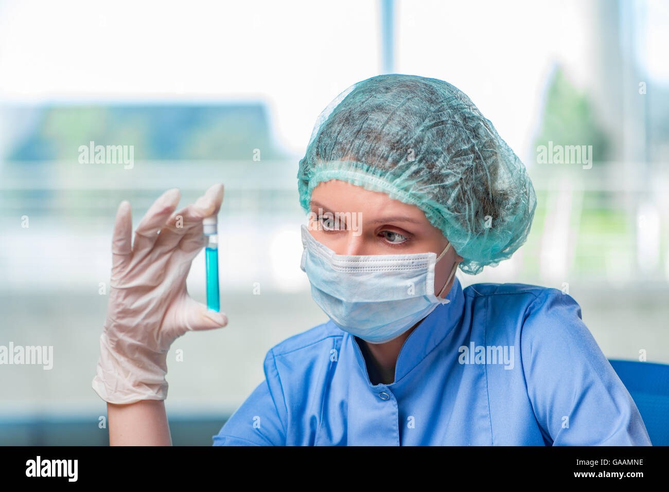 Experienced lab assistant working on chemical solutions Stock Photo - Alamy