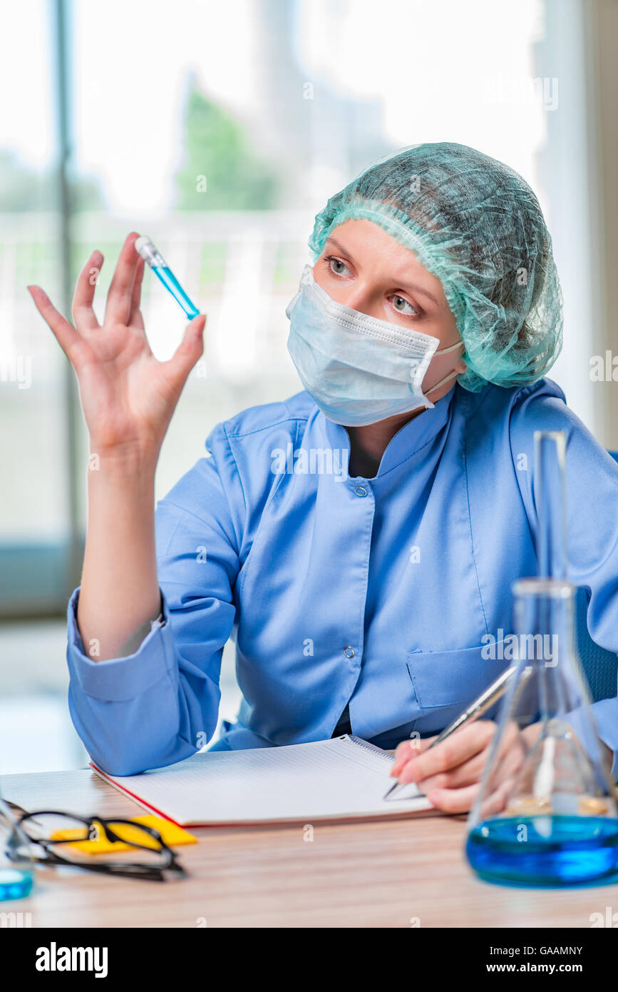 Experienced lab assistant working on chemical solutions Stock Photo - Alamy