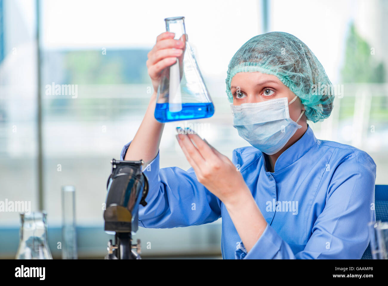 Experienced lab assistant working on chemical solutions Stock Photo - Alamy