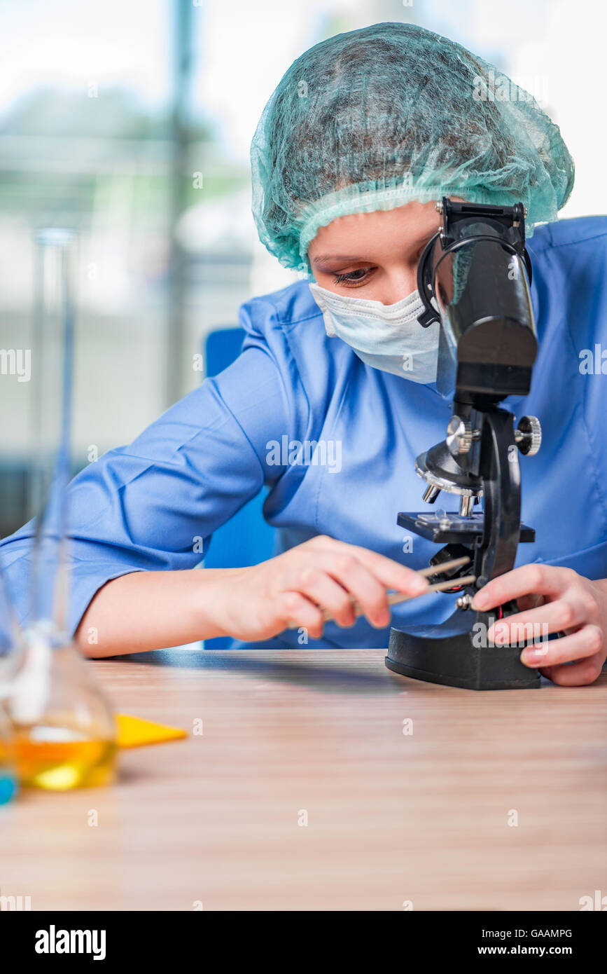 Experienced lab assistant working on chemical solutions Stock Photo - Alamy