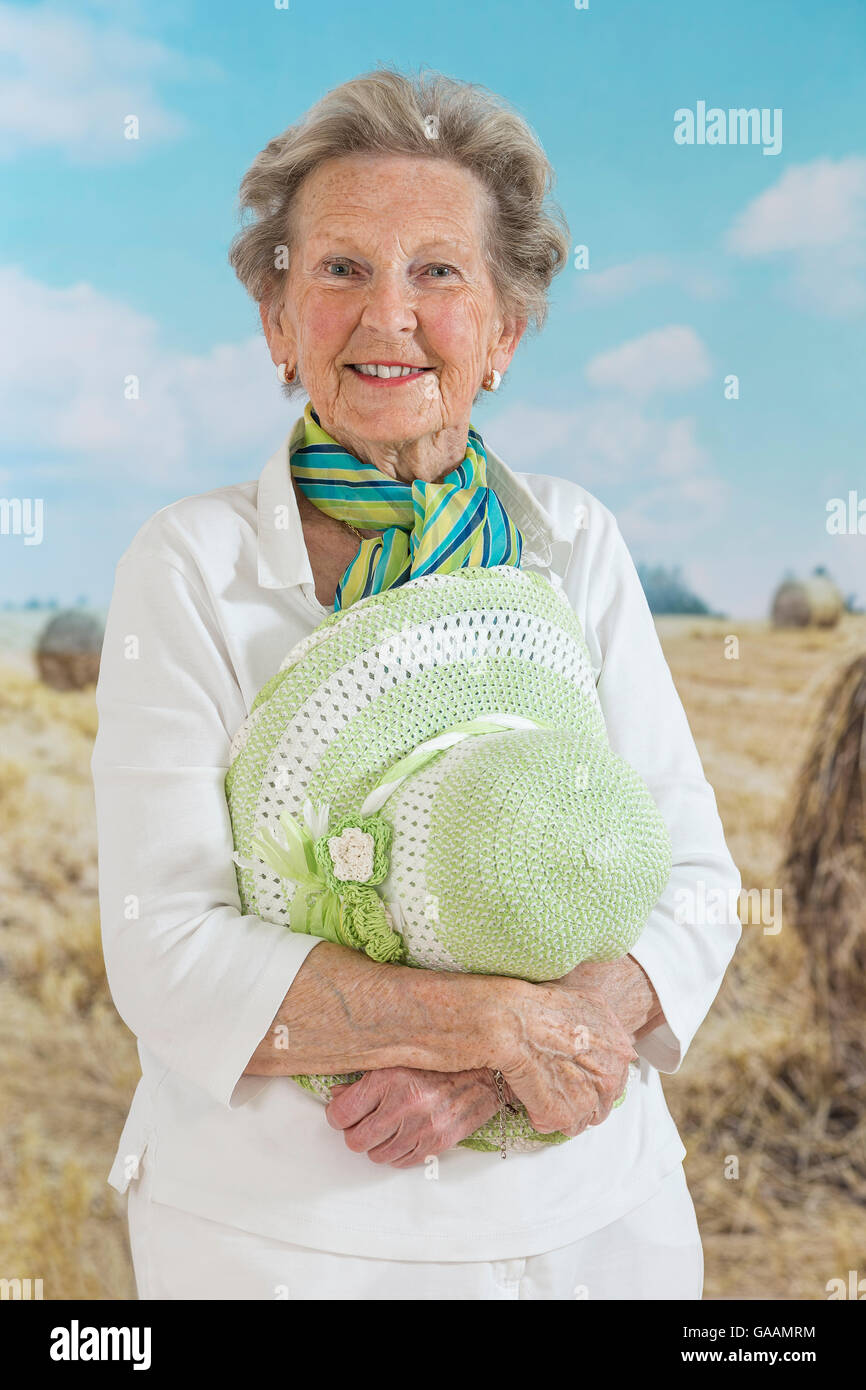 beautiful smiling senior woman enjoying life in countryside Stock Photo ...
