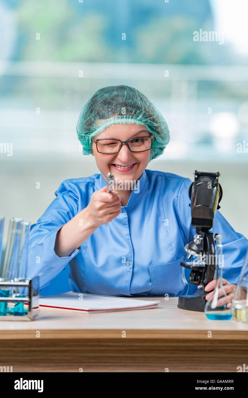 Experienced lab assistant working on chemical solutions Stock Photo - Alamy