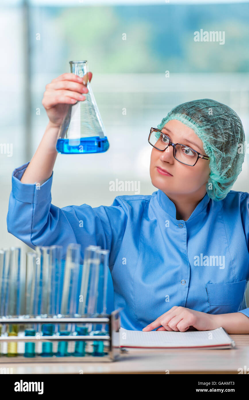 Experienced lab assistant working on chemical solutions Stock Photo - Alamy