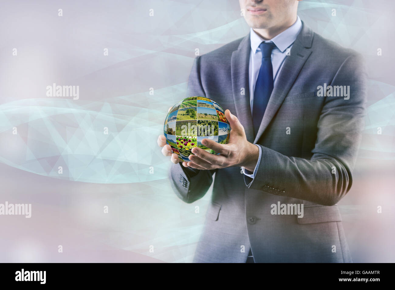 Man holding earth with nature photos Stock Photo - Alamy