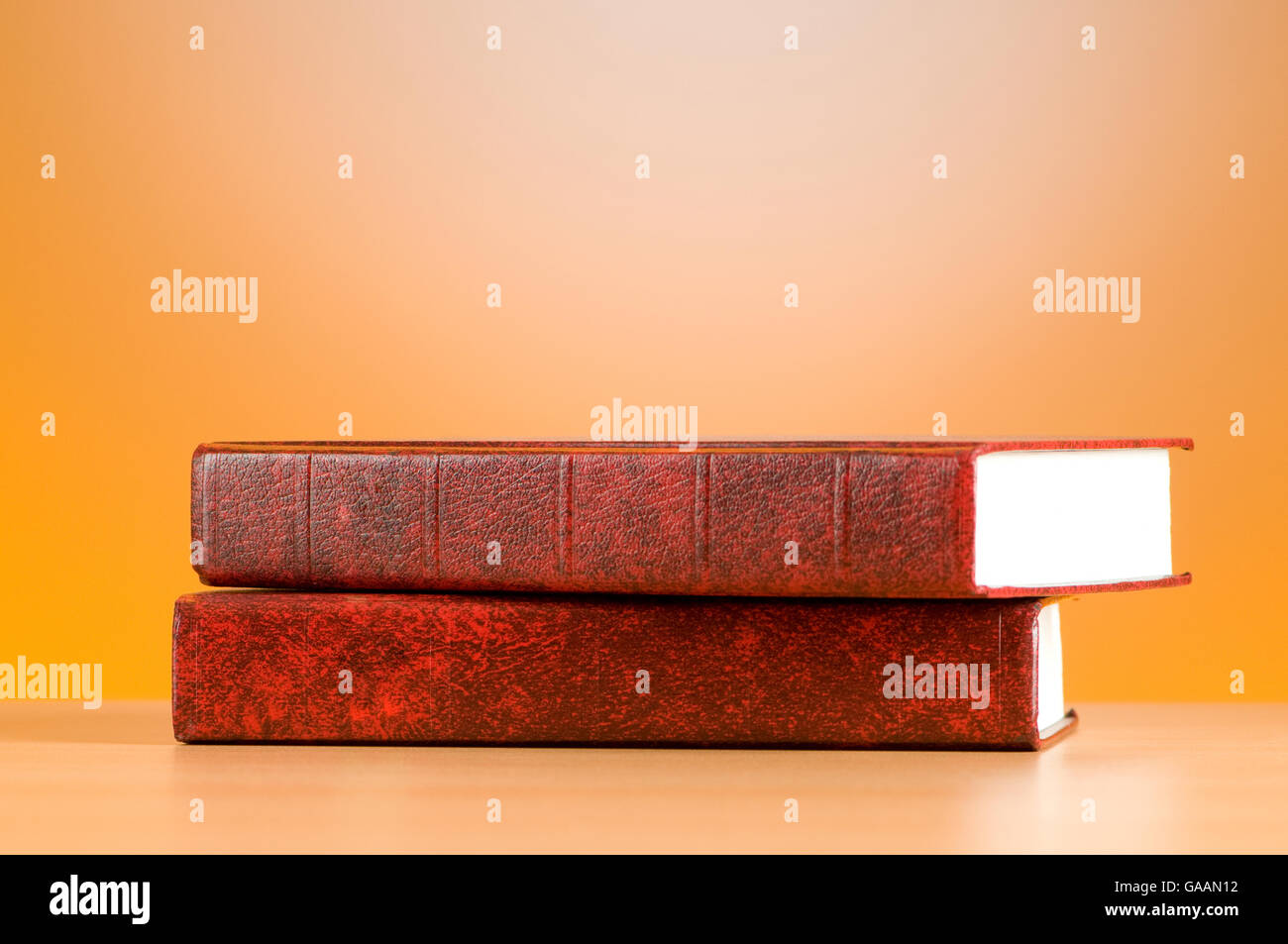 Education concept with red cover books Stock Photo - Alamy