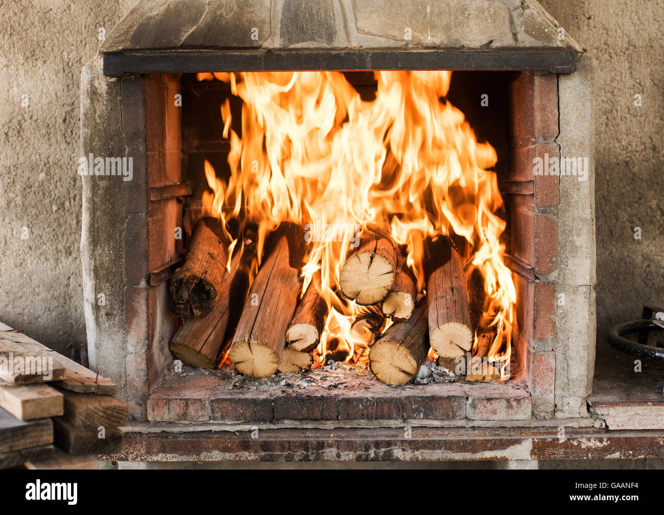Burning wood in the fireplace. Strong flame Stock Photo - Alamy
