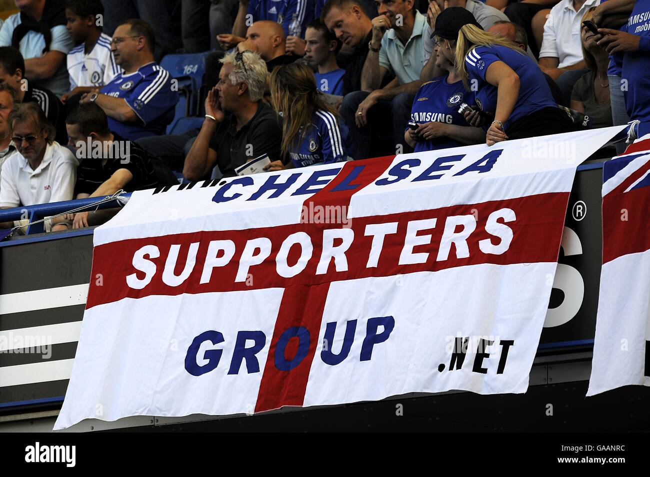 Chelsea fans hang a banner to support their team hi-res stock ...