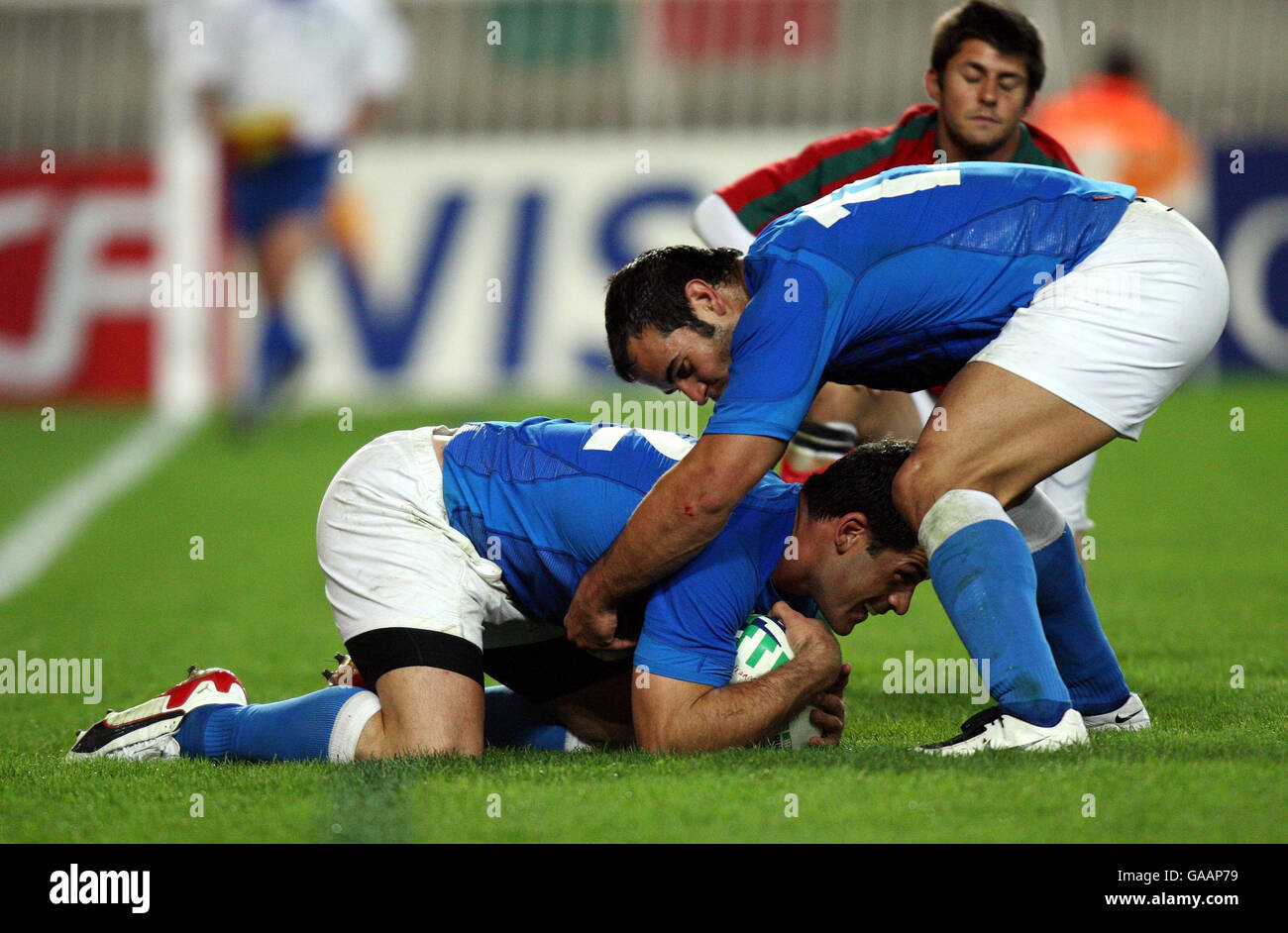 Andreas Masi is congratulated by Gonzalo Canale after scoring Italy's ...