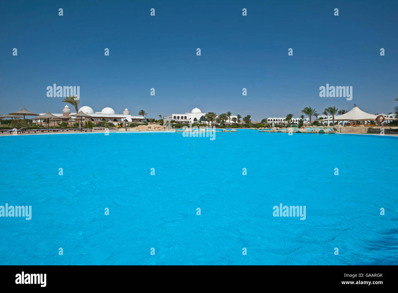 Large swimming pool at a luxury tropical hotel resort Stock Photo - Alamy