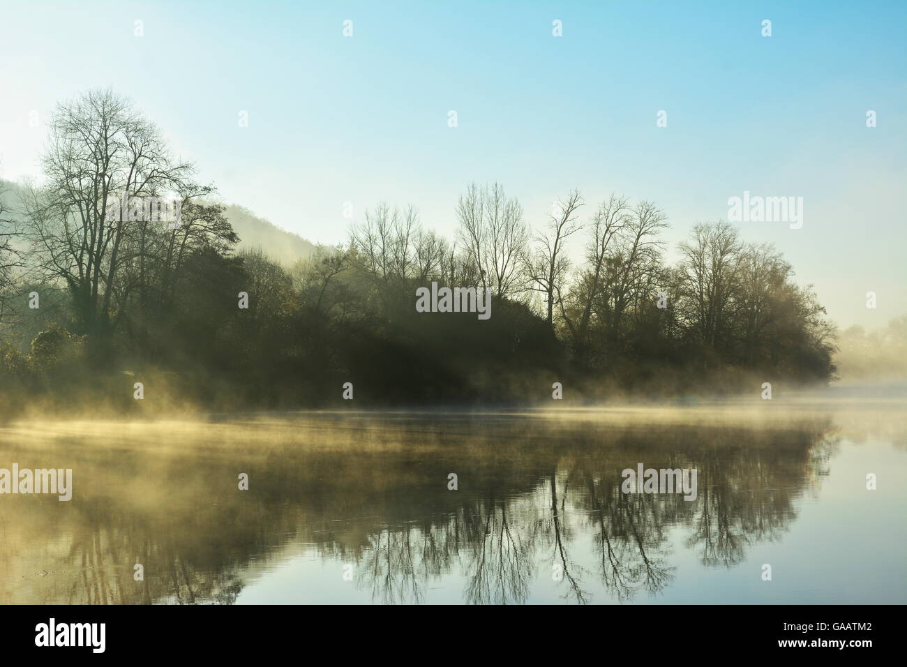 rising early winter morning fog and mist on lake or river Stock Photo ...