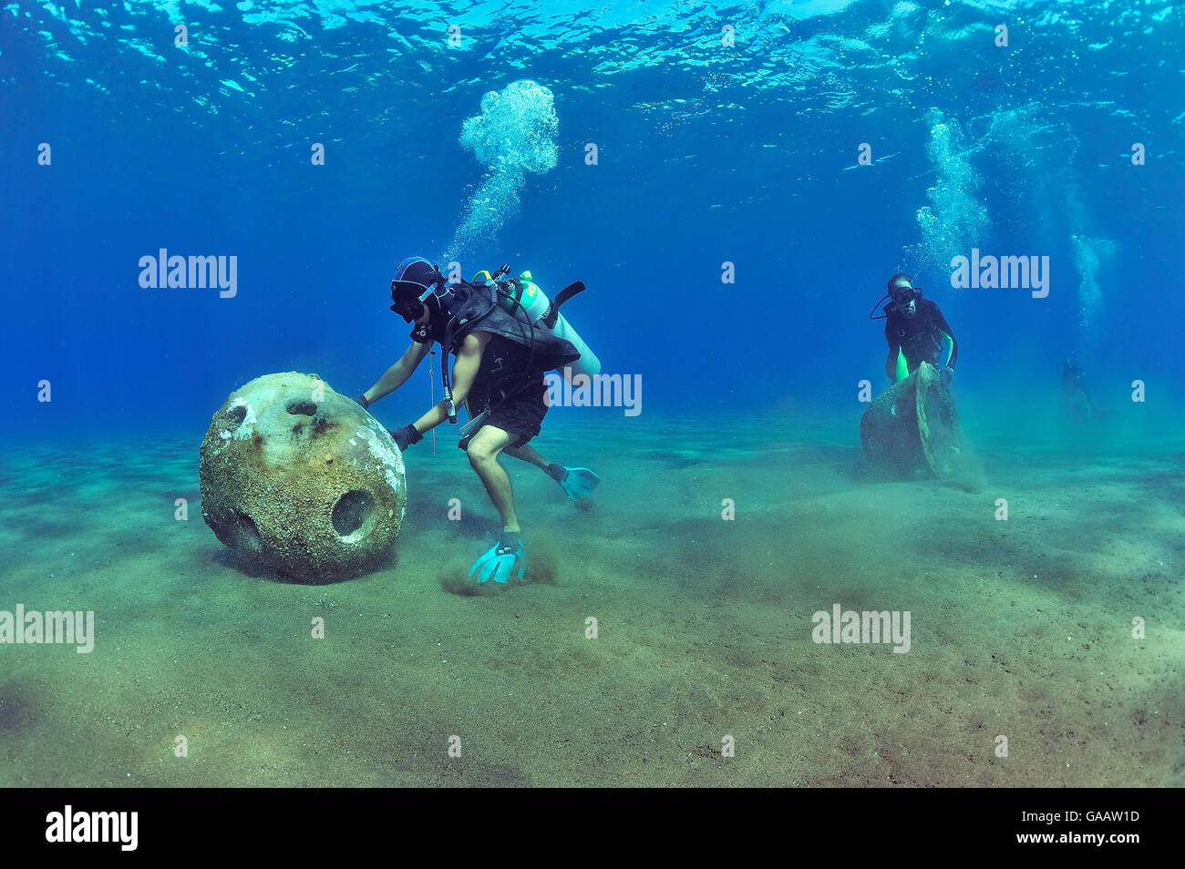 Divers are setting up concrete reef balls to build an artificial reef ...