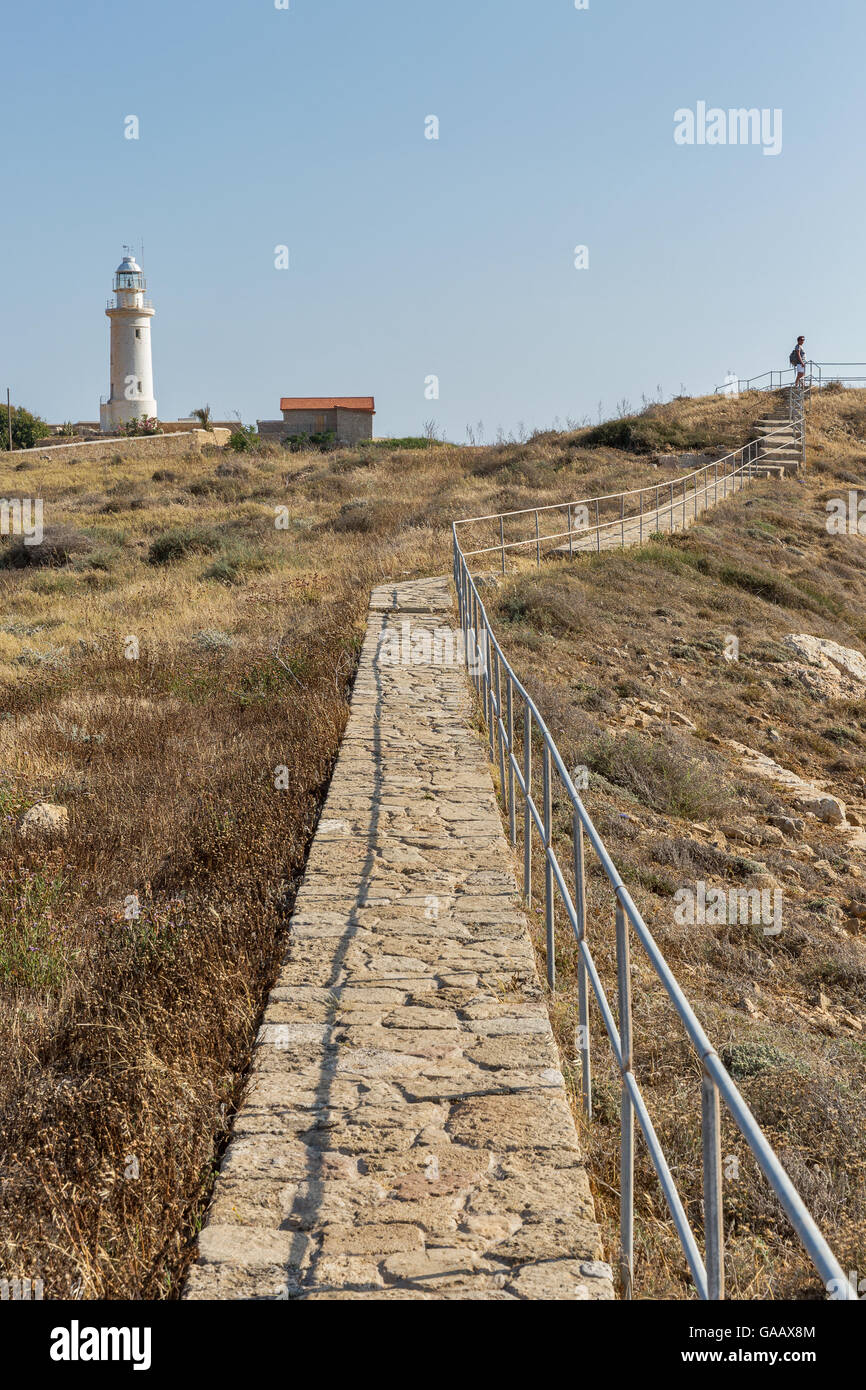 Paphos landscape with old mediterranean lighthouse and woman on Cyprus ...