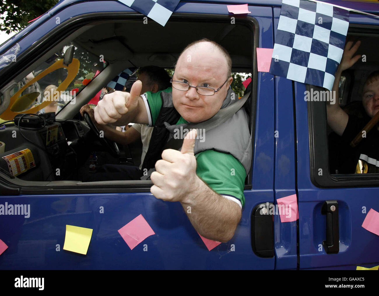 Anthony Sherlock waves to the crowd while participating in the 48th ...