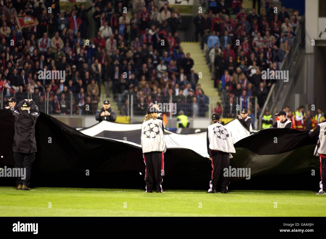 Ball boys and girls wave the UEFA Champions League flag Stock Photo - Alamy