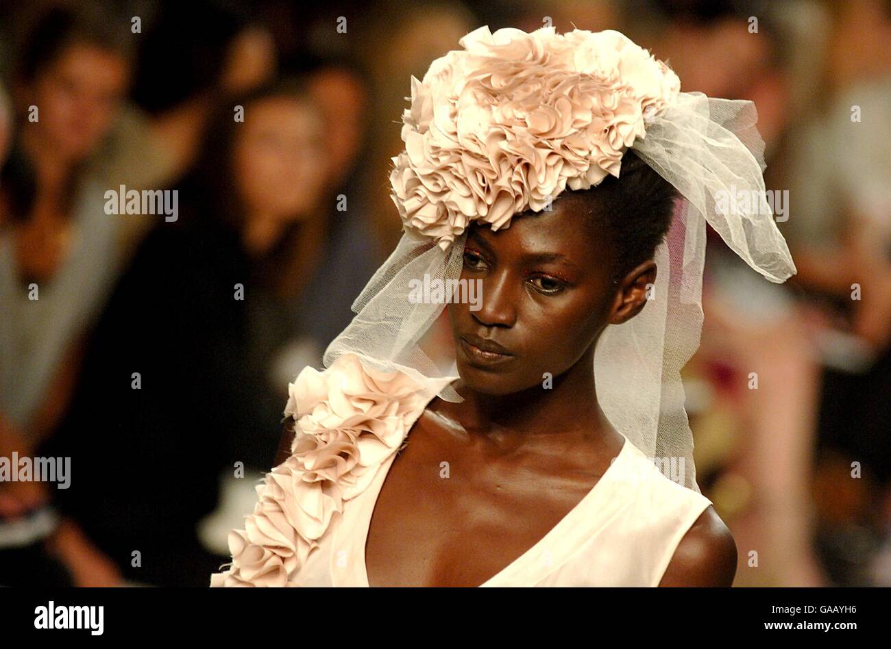 A model wears a creation by designer John Rocha during London Fashion ...