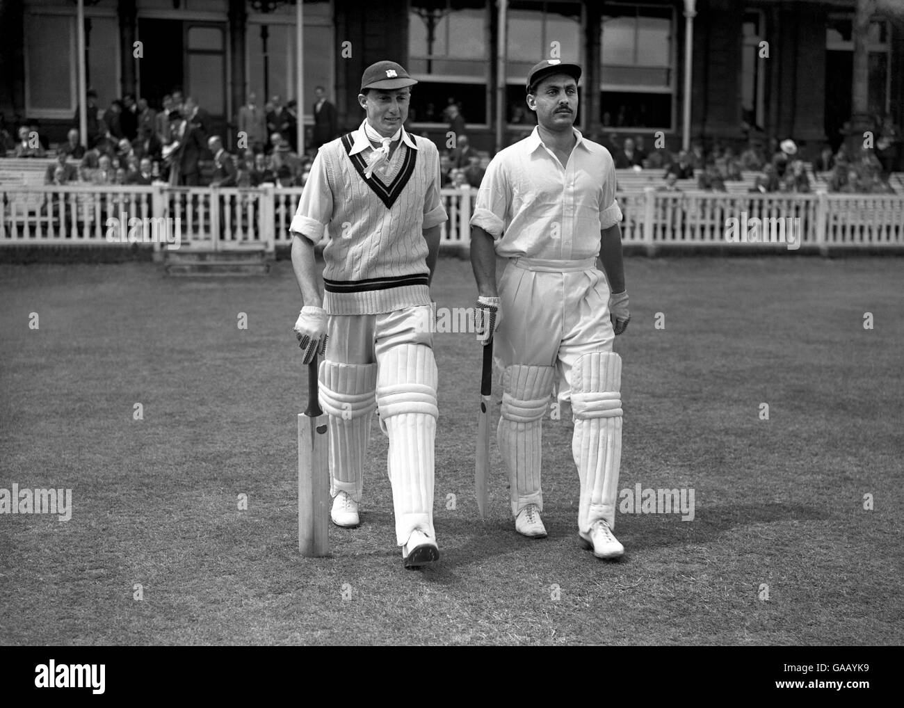 Allan Rae (l) and Jeffrey Stollmeyer (r) make their way to the crease ...