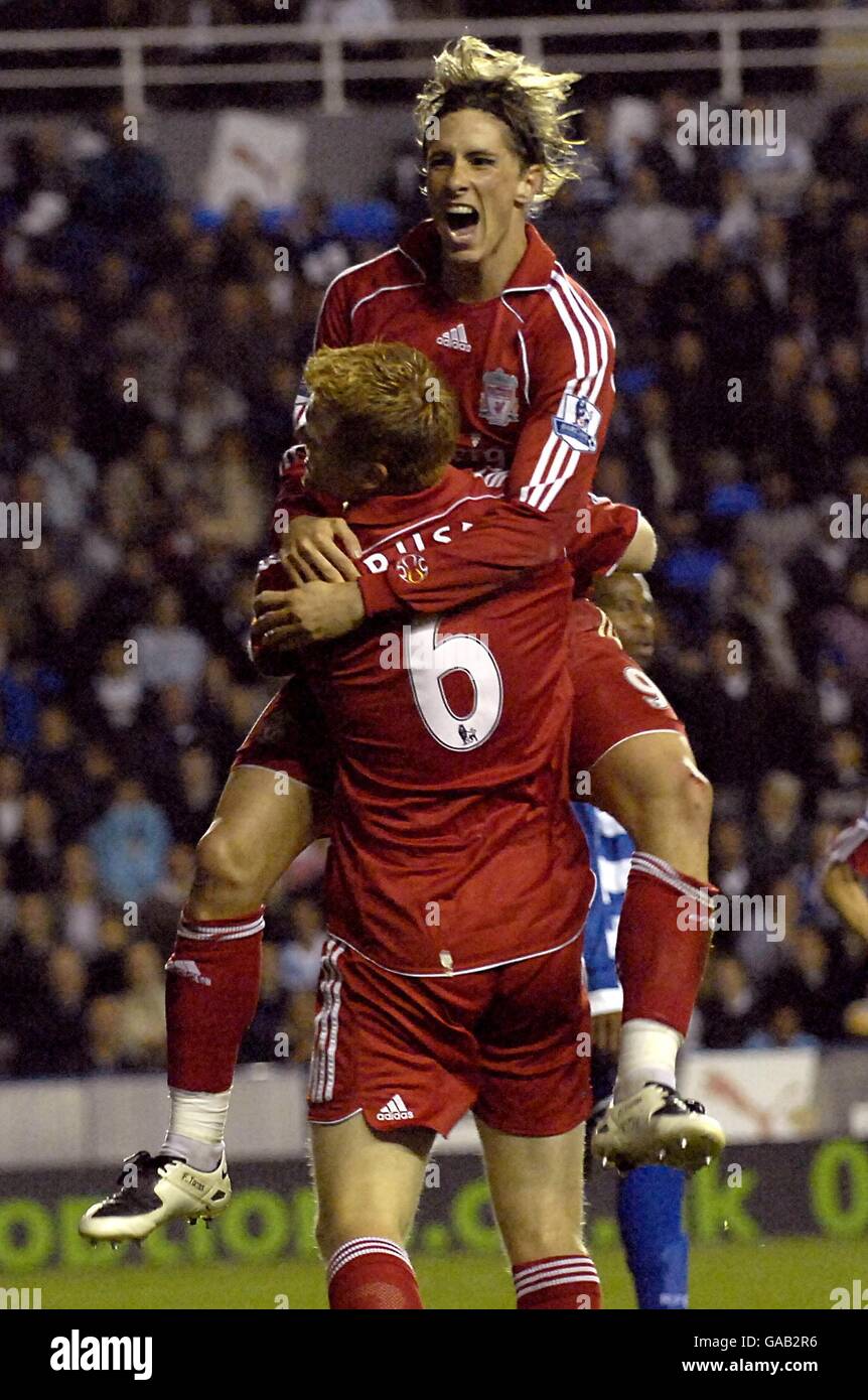 Liverpool's Fernando Torres (top) celebrates with team mate John Arne ...