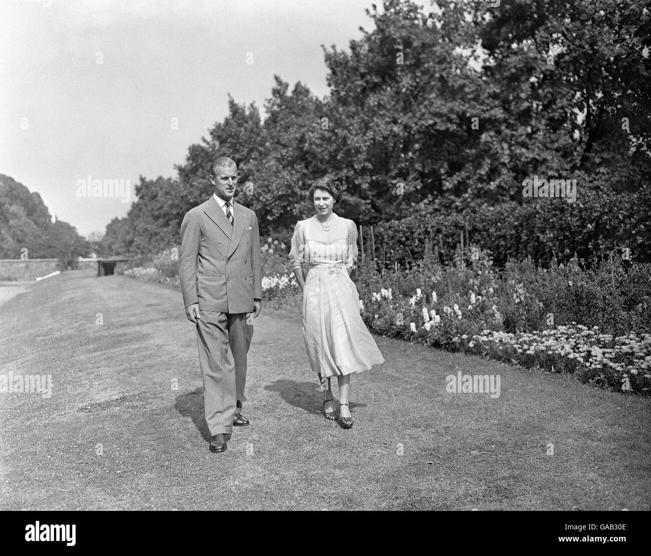 Princess Elizabeth with the Duke of Edinburgh, in the grounds of ...