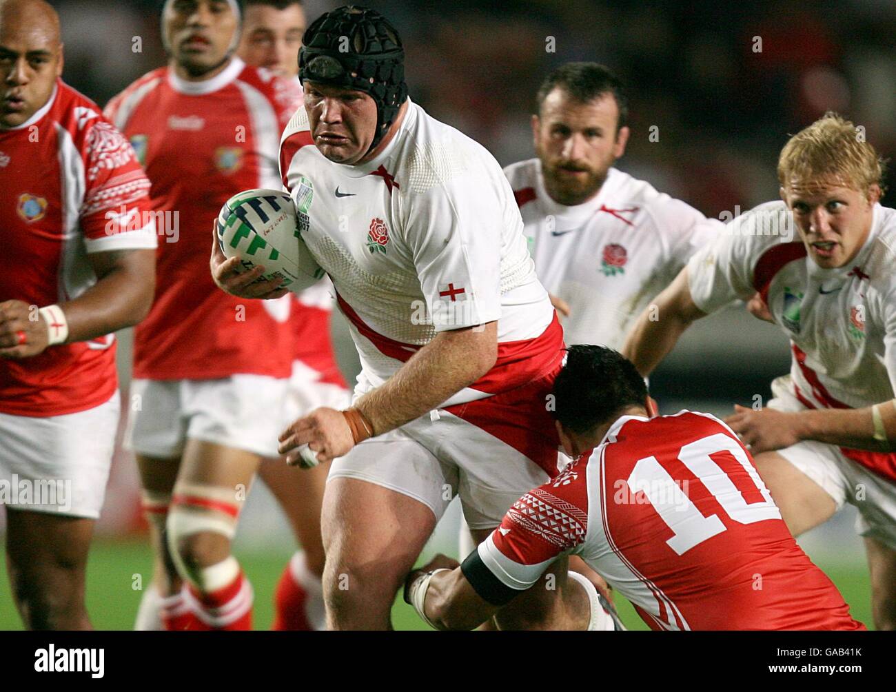 England's Matt Stevens on the charge against Tonga's Pierre Hola Stock ...
