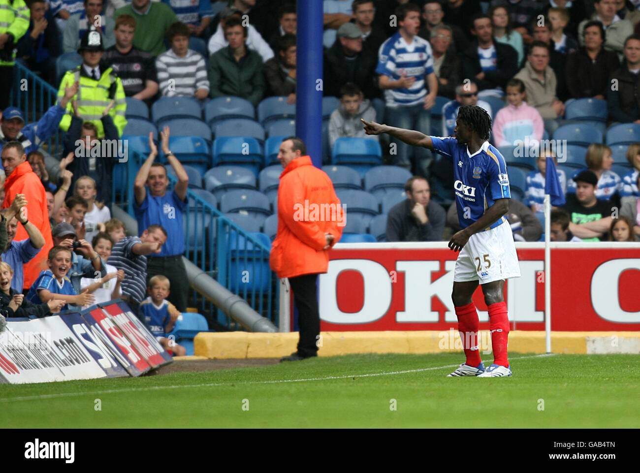 Portsmouth's Benjani Mwaruwari celebrates his second goal by pointing ...